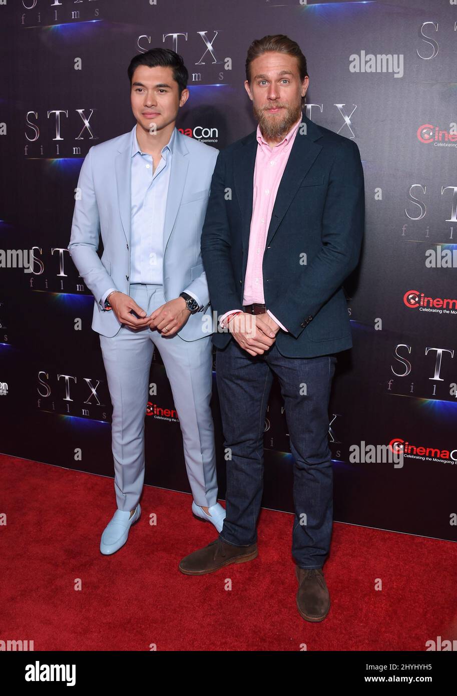 Henry Golding and Charlie Hunnam arriving to CinemaCon 2019 - STXfilms ...