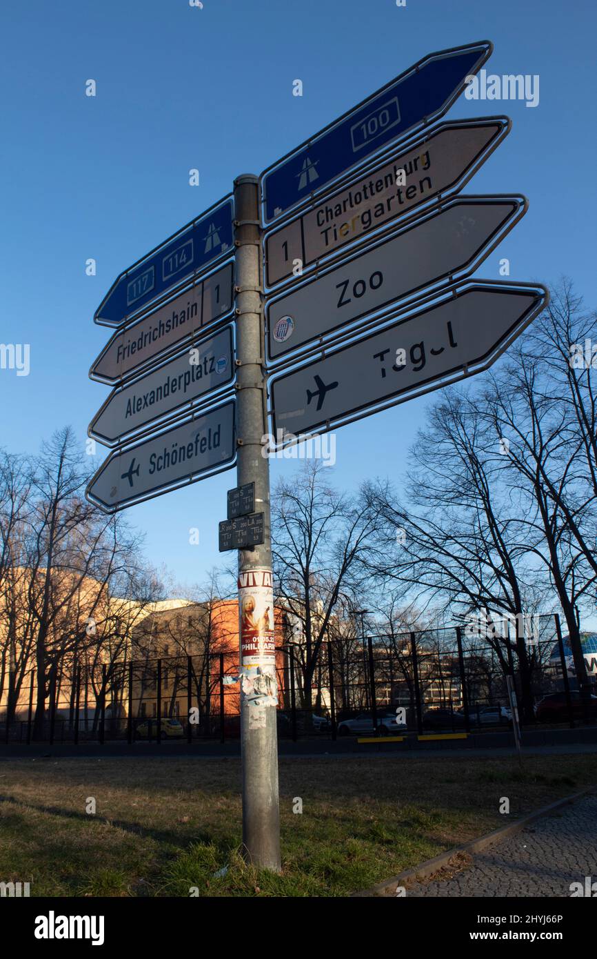 Road sign pointing to destinations in different parts of the city ...