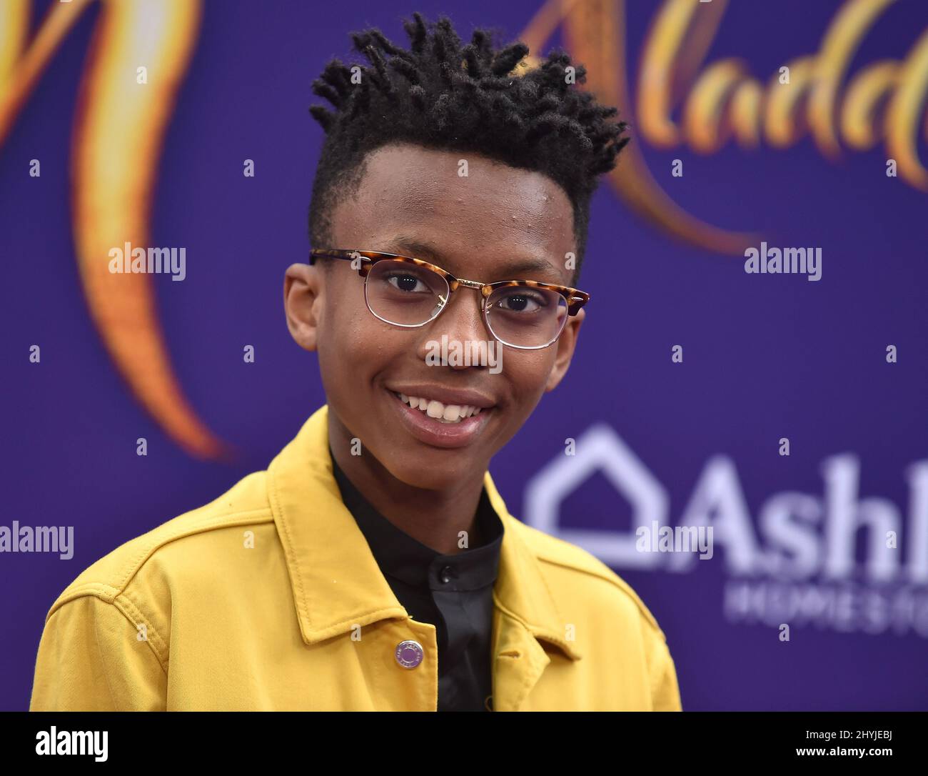 Israel Johnson arriving to the 'Aladdin' World Premiere at El Capitan ...