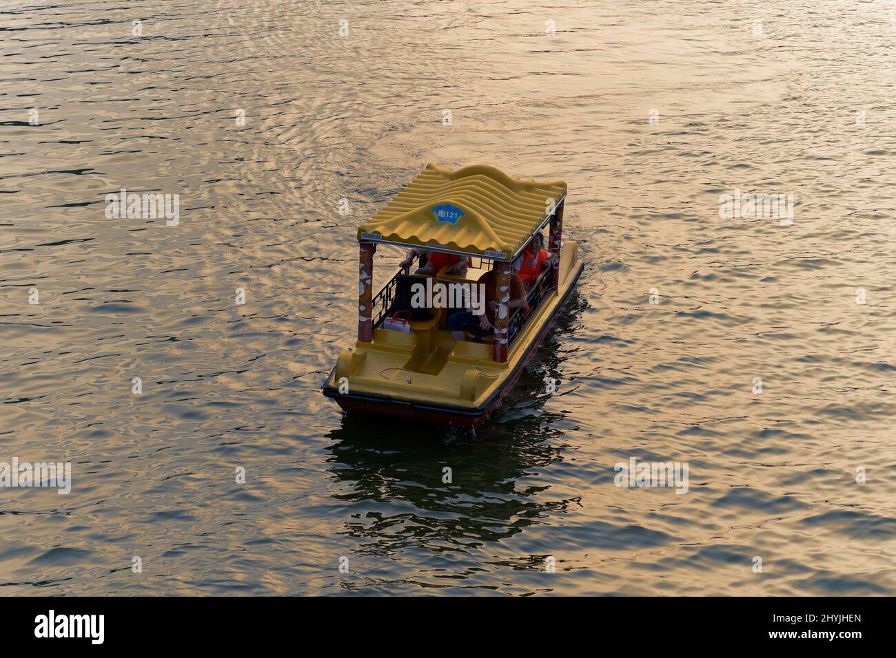 Beautiful boat in a lake at sunset Stock Photo - Alamy