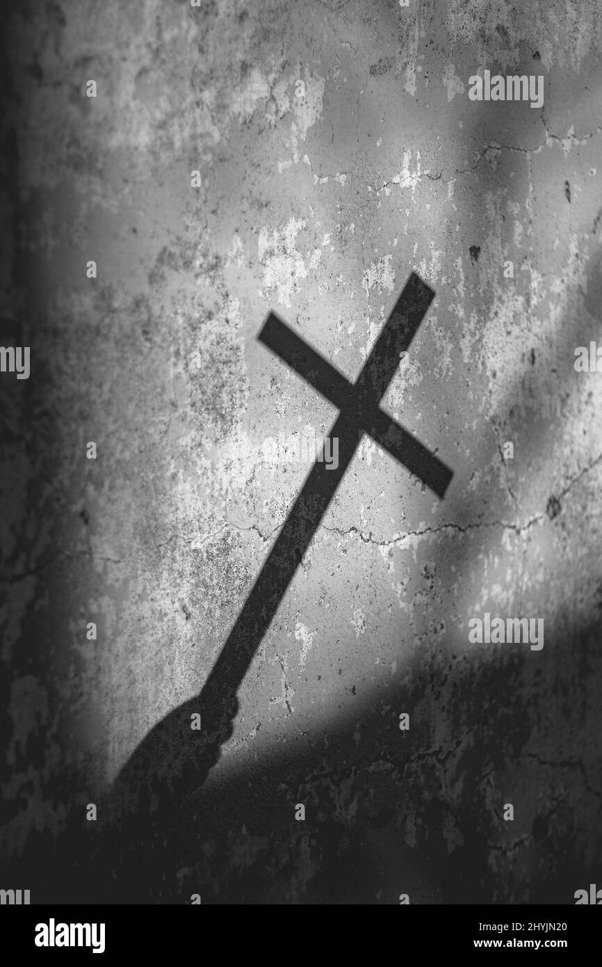 Vertical grayscale closeup of the shadow of the cross on the wall Stock ...