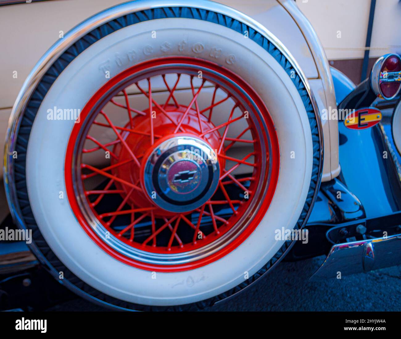 Spare wheel of an old car designed with a multitude of small spokes ...