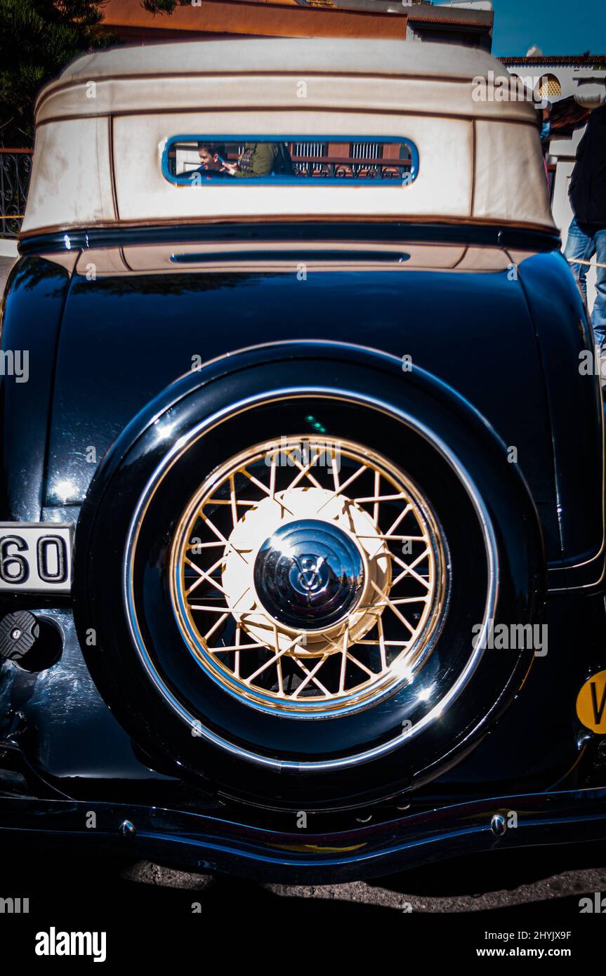 Spare wheel in an old car designed with a multitude of small spokes ...