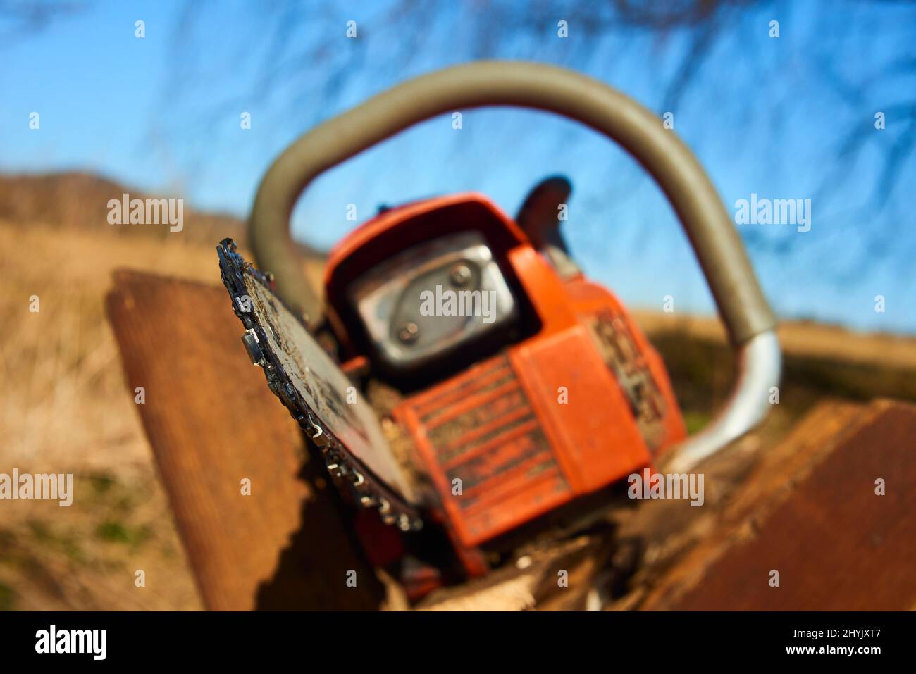 Detail of dirty used chainsaw chain for cutting wood. Selective focus ...
