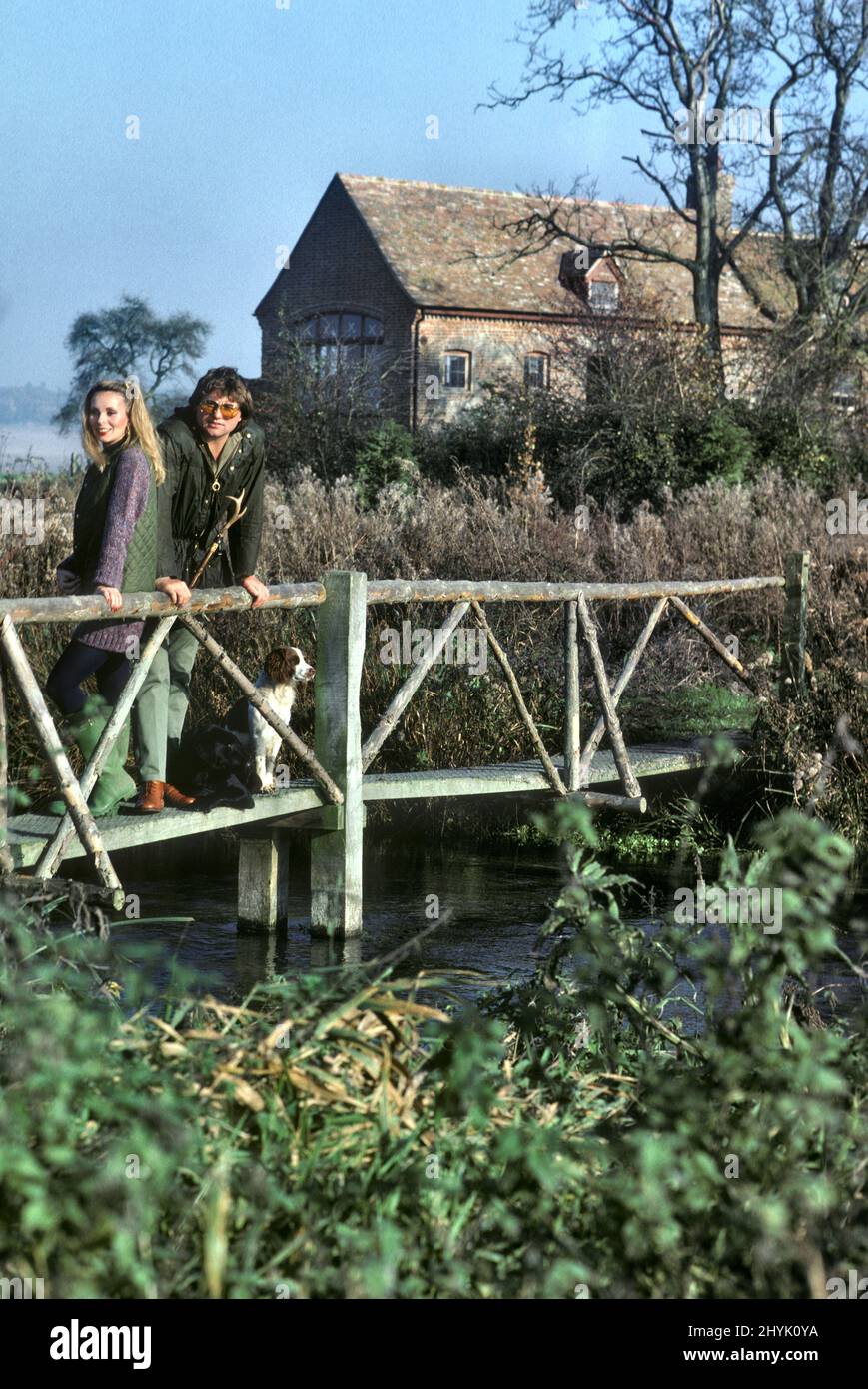Greg Lake with his wife and dog at his home in Hampshire 1981 Stock ...