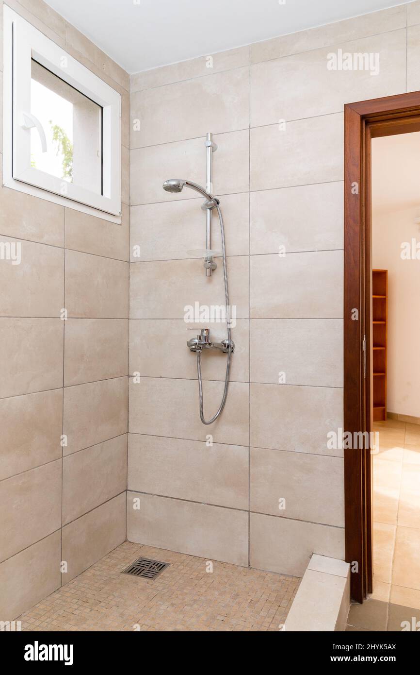 Vertical shot of a modern shower room interior Stock Photo - Alamy