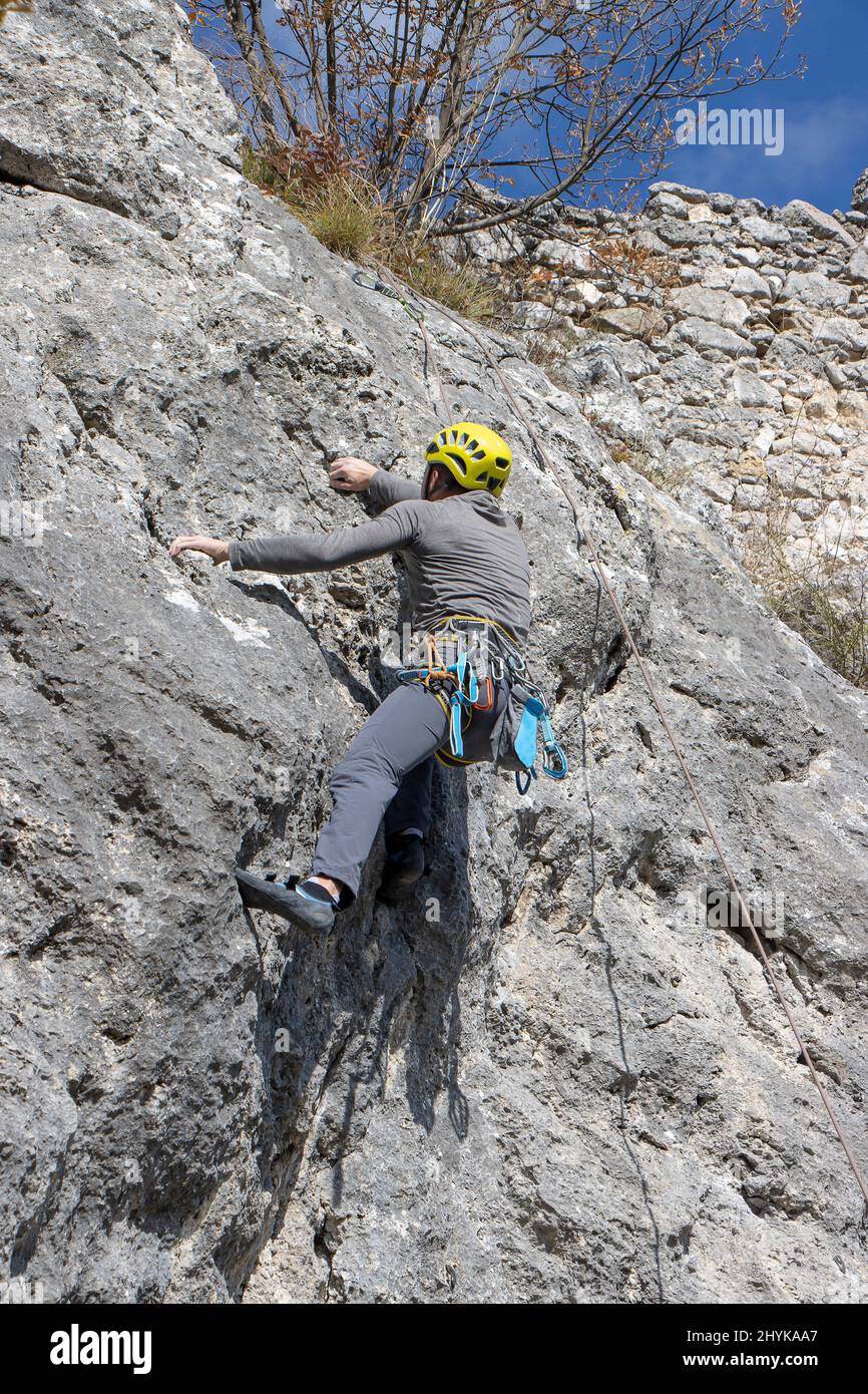 A Young free climber climbs on a cliff Stock Photo - Alamy
