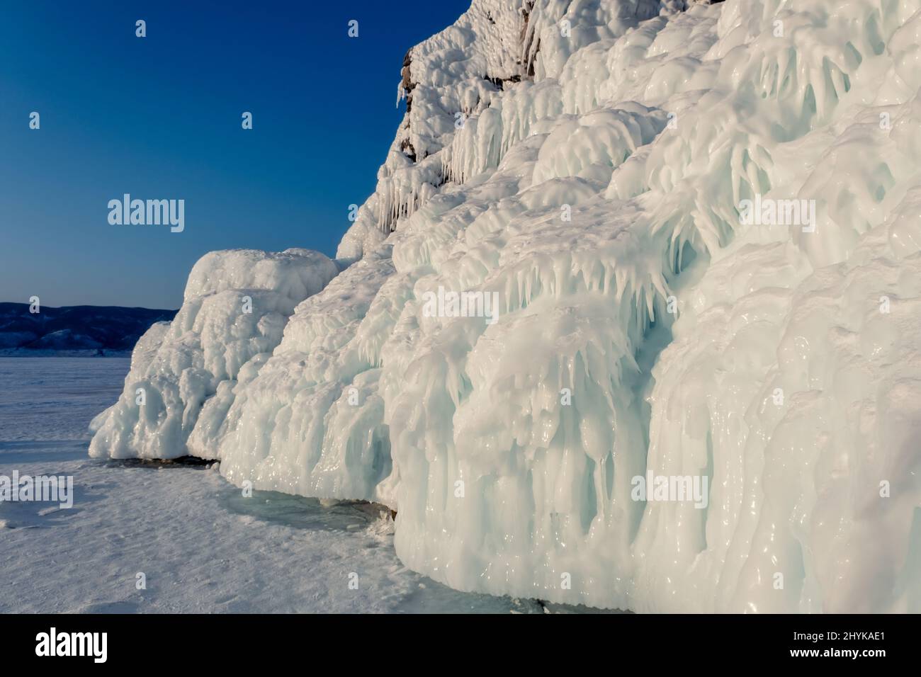 Ice and icicles on rocks on Lake Baikal Stock Photo - Alamy