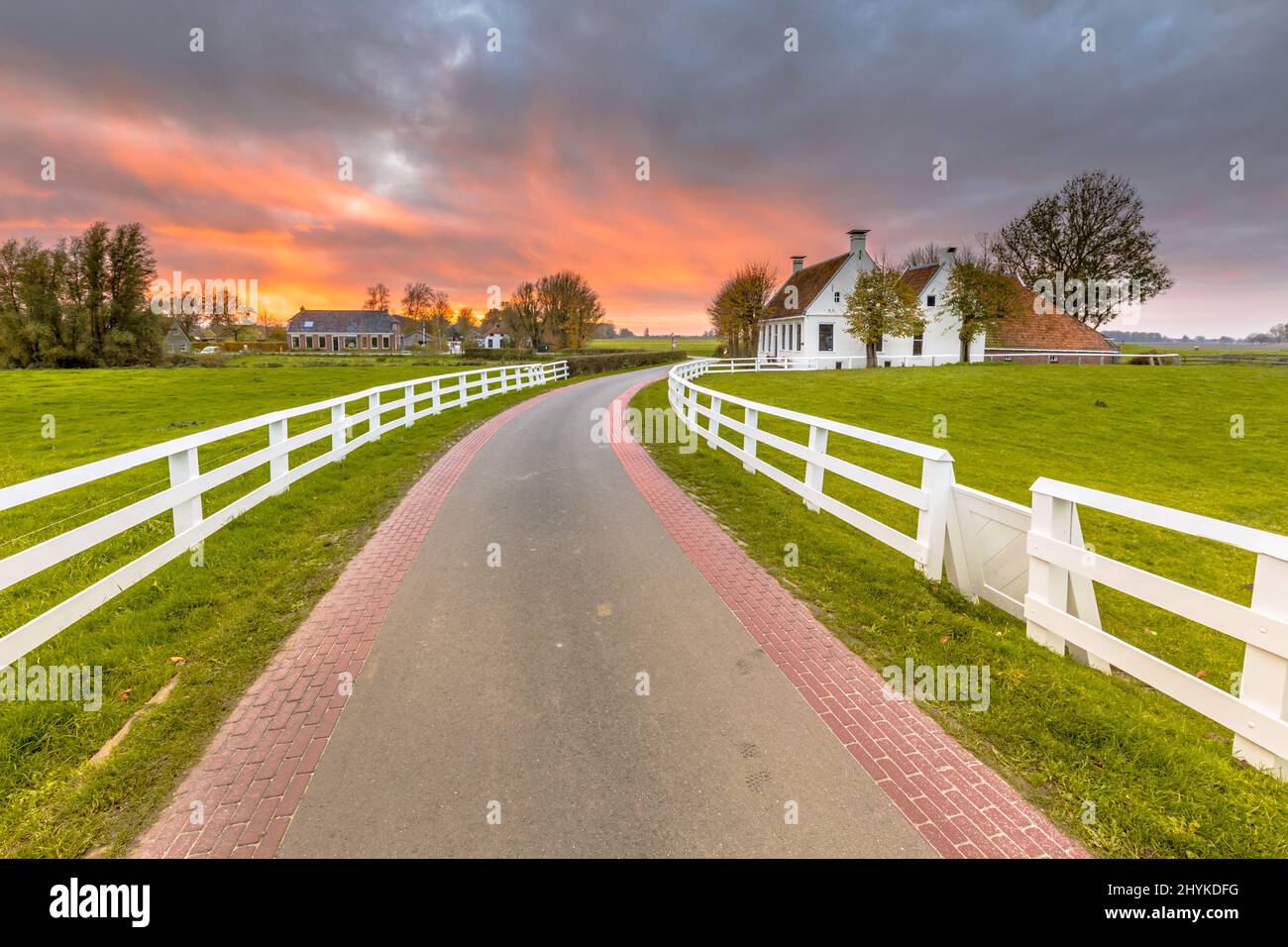 Dutch Countryside landscape with historical houses in evening along a ...