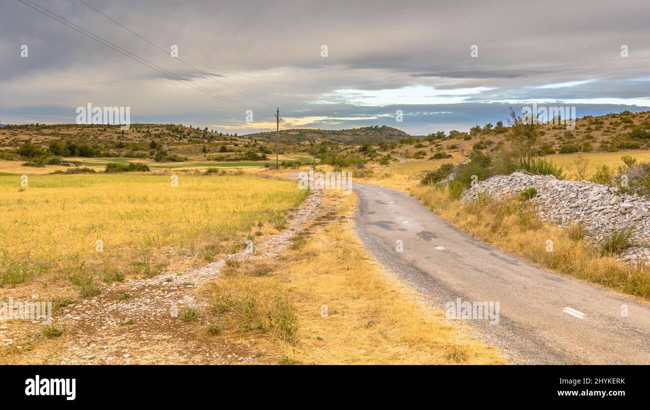 Sunrise over road in highland limestone karst plateau landscape on ...