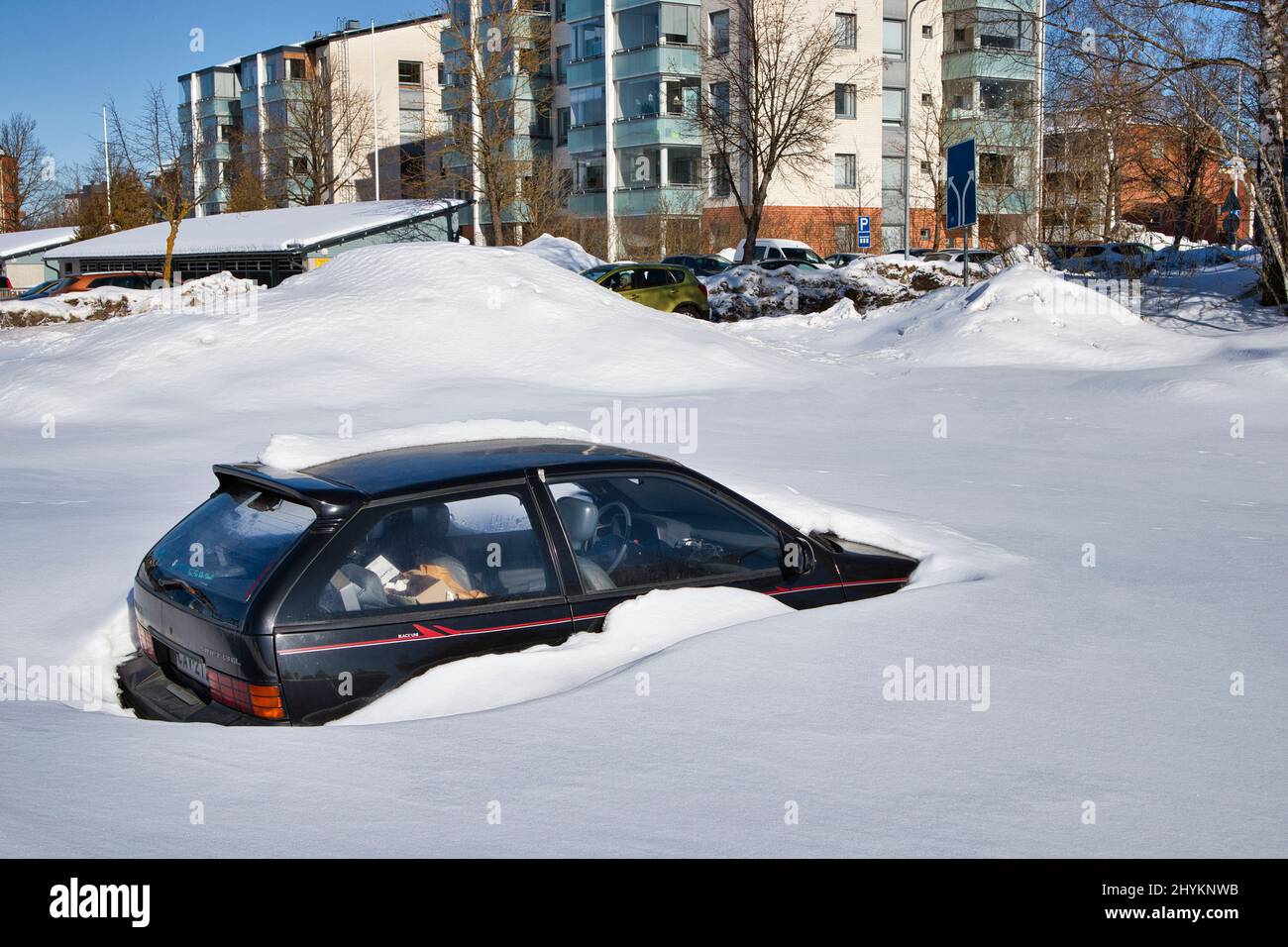 car buried in snow at a parking lot Stock Photo - Alamy