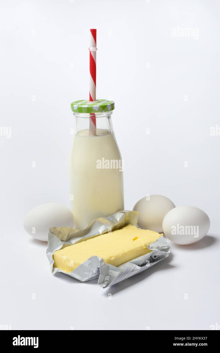 Butter in opened packaging, eggs and bottle of milk Stock Photo - Alamy