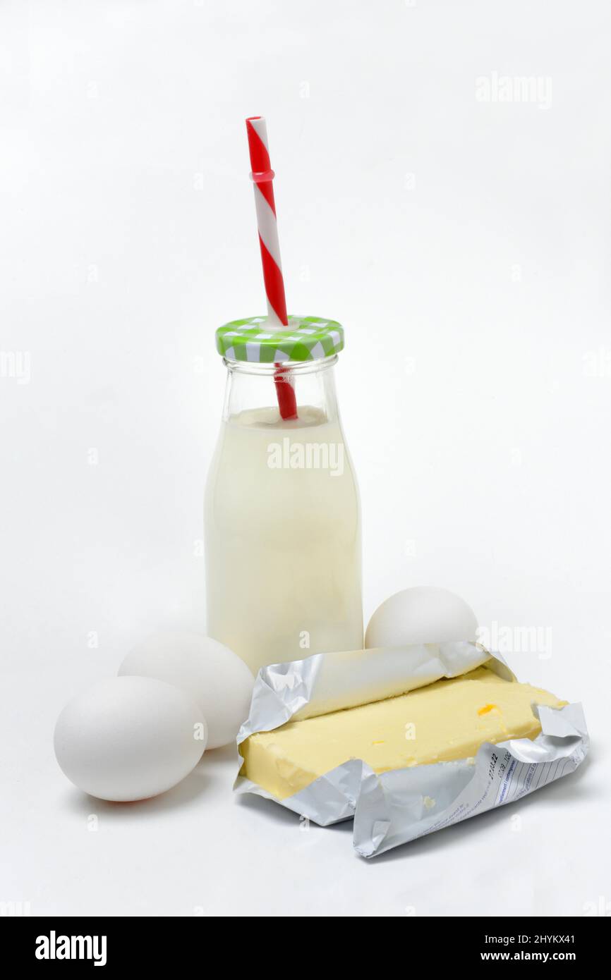 Butter in opened packaging, eggs and bottle of milk Stock Photo - Alamy