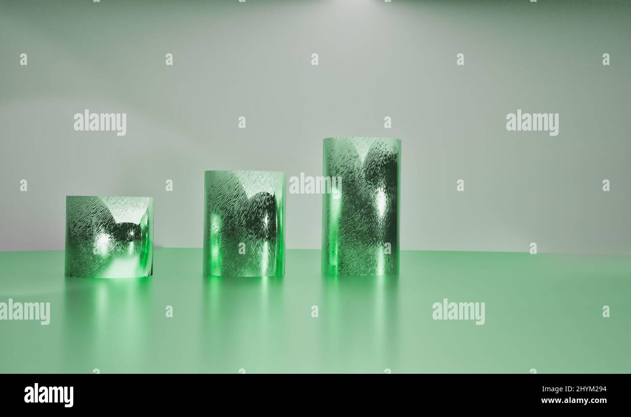 Photo of green cylindrical shapes of different heights Stock Photo - Alamy