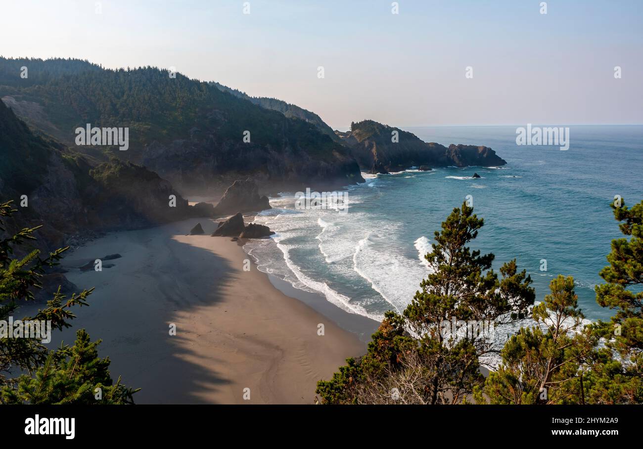 Sandy beach beach by the sea, coastal landscape with rugged rocks ...