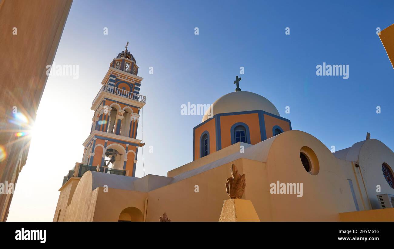 Soft morning light, wide angle, sun star-shaped next to church tower ...