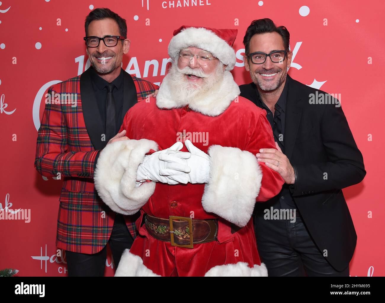 Lawrence Zarian, Santa Claus and Gregory Zarian attending the Christmas ...