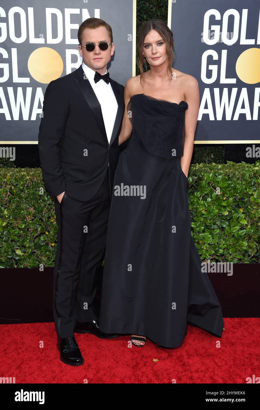 Taron Eggerton and Emily Robinson at the 77th Golden Globe Awards held ...