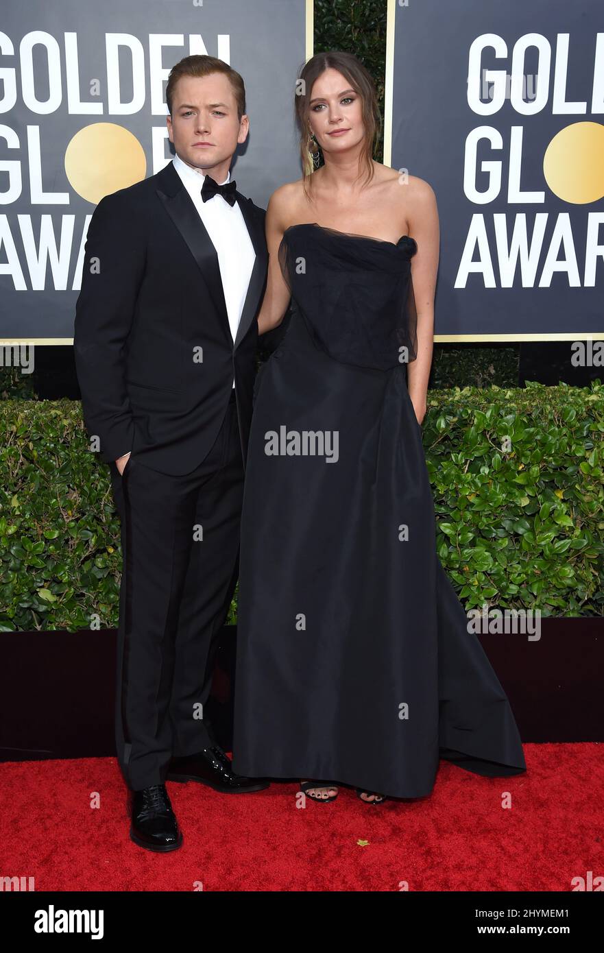 Taron Eggerton and Emily Robinson at the 77th Golden Globe Awards held ...