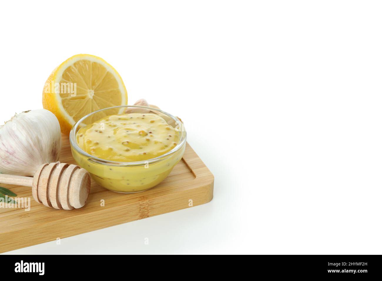 Composition of cooking mustard honey sauce isolated on white background ...
