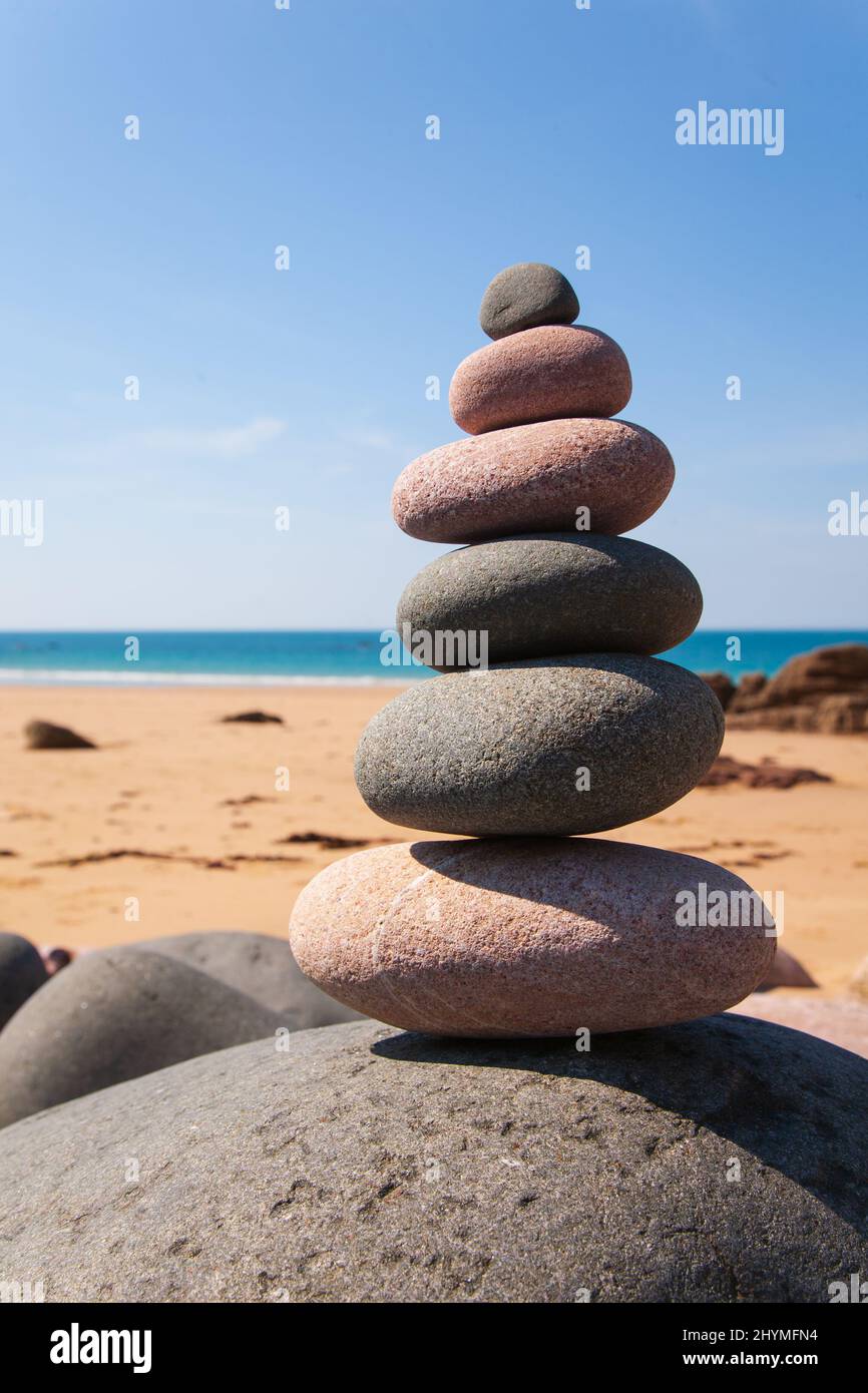 Pebble tower made on the beach in Brittany Stock Photo - Alamy