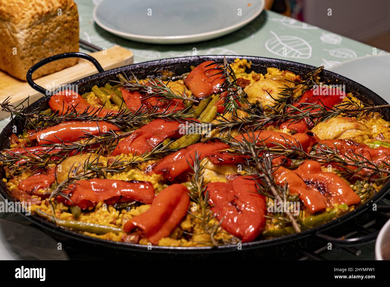 Closeup of delicious Paella served on the table Stock Photo - Alamy
