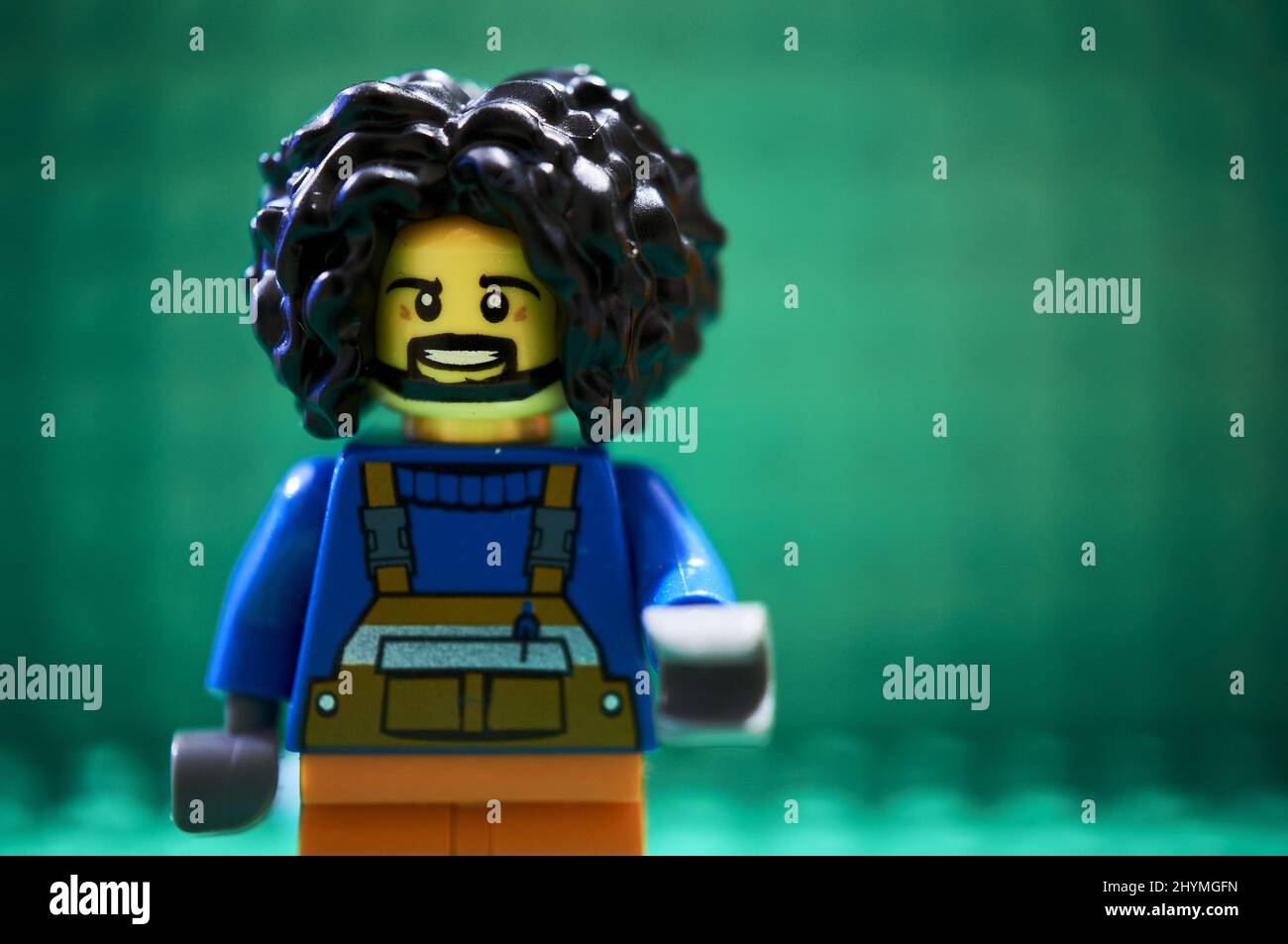 Closeup of a construction worker Lego toy with dreadlocks against a ...