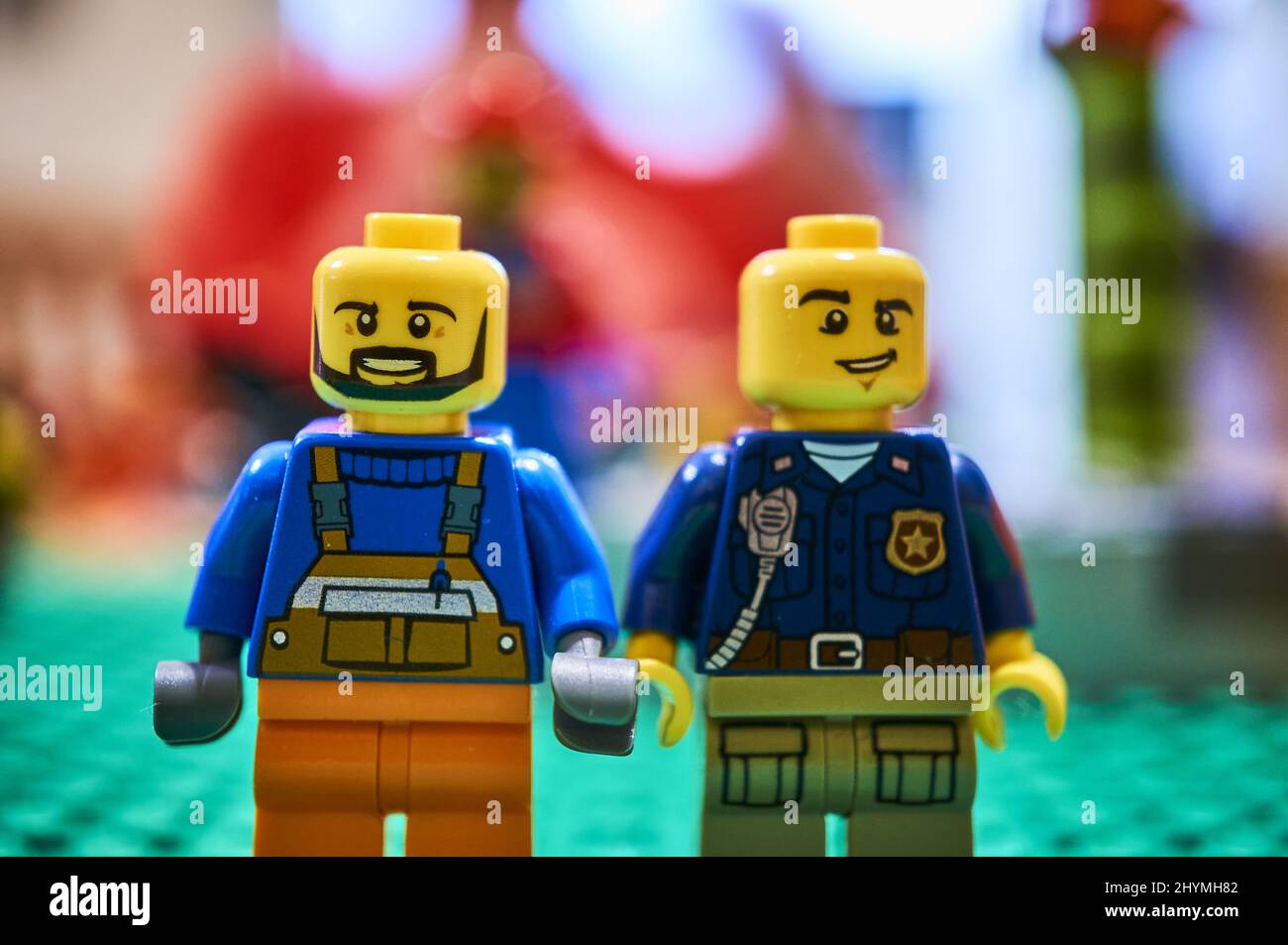 Closeup of a construction worker and police officer Lego toys against a ...