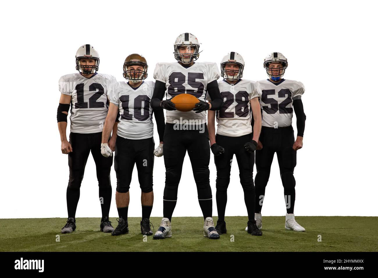 Group of young sportive men, professional american football players in ...
