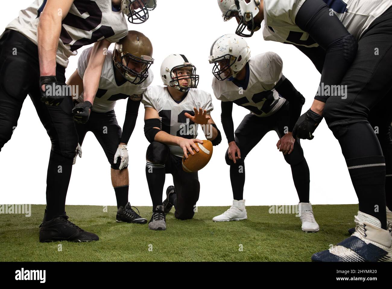 Group of young sportive men, professional american football players in ...