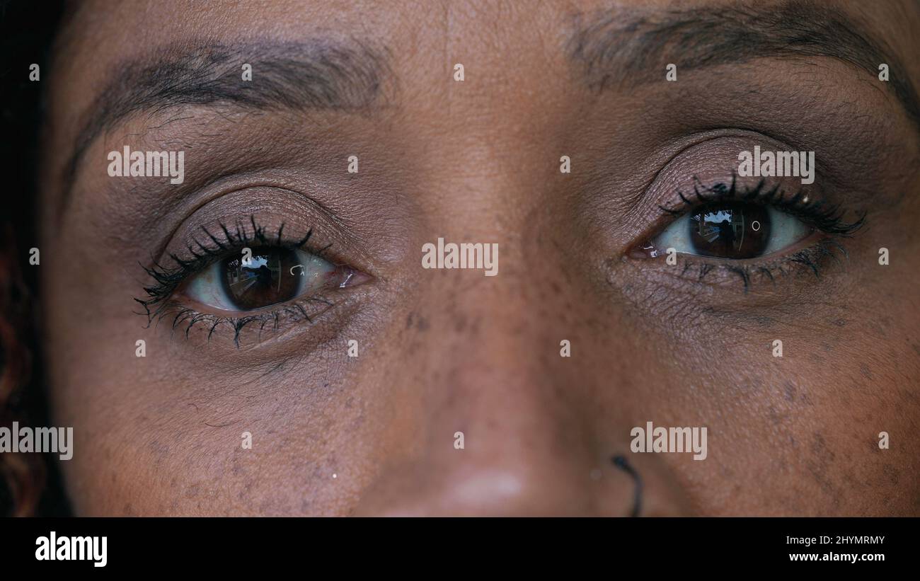 A black woman eyes close-up looking at camera macro closeup of person ...