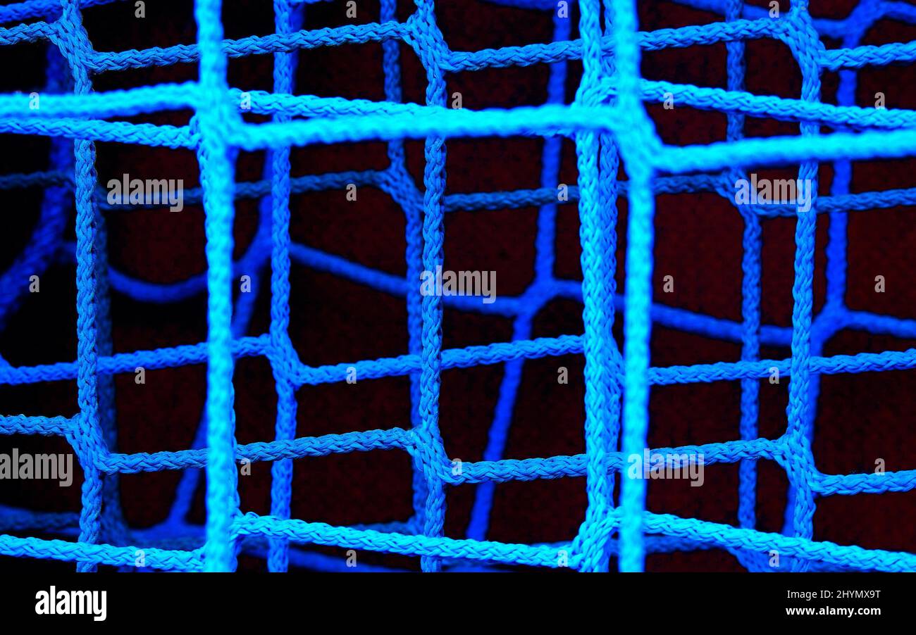 Close-up, various blue nets of small football goals, superimposed on ...
