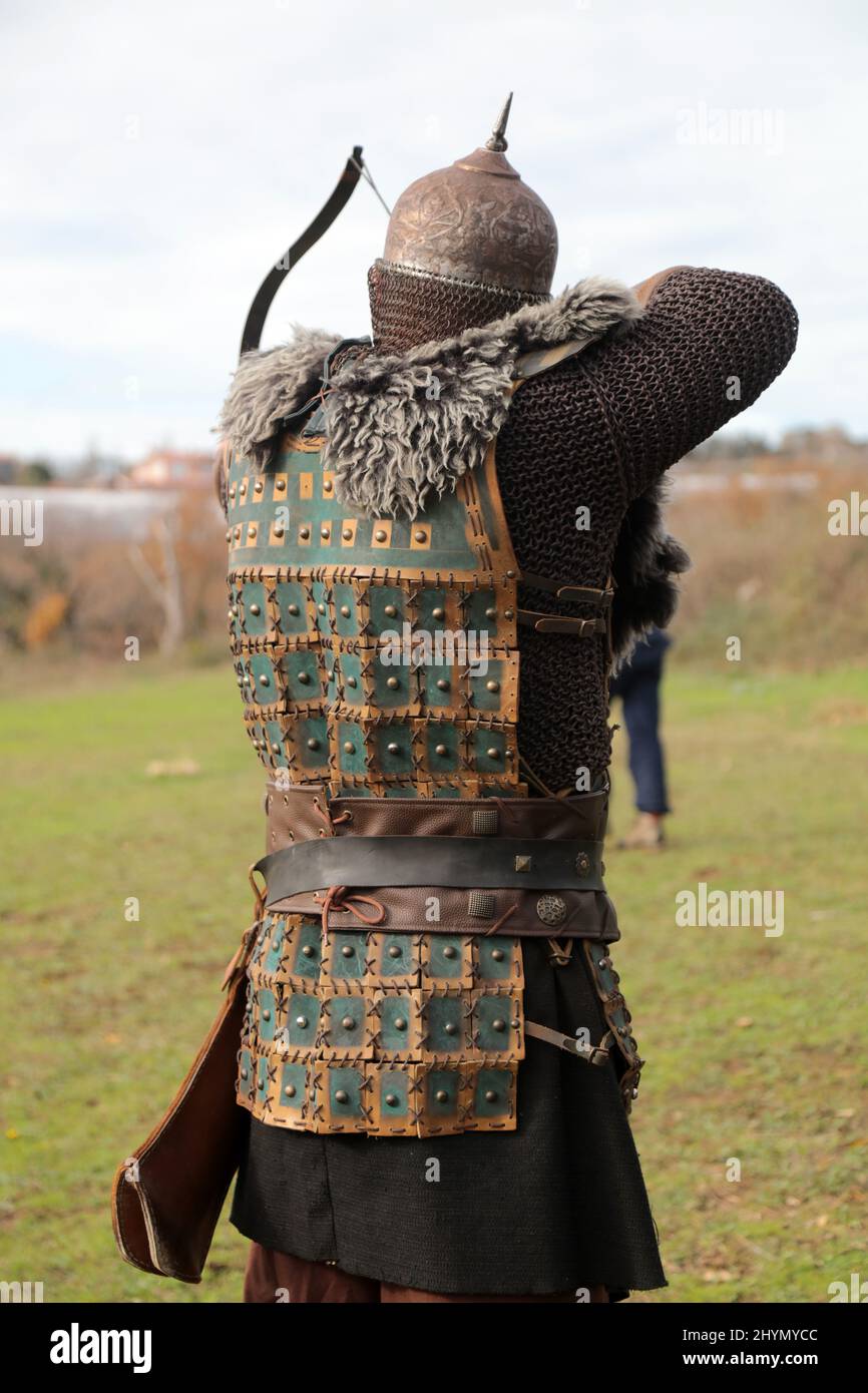 A Turkish soldier in traditional clothing. Back view of archer soldier ...