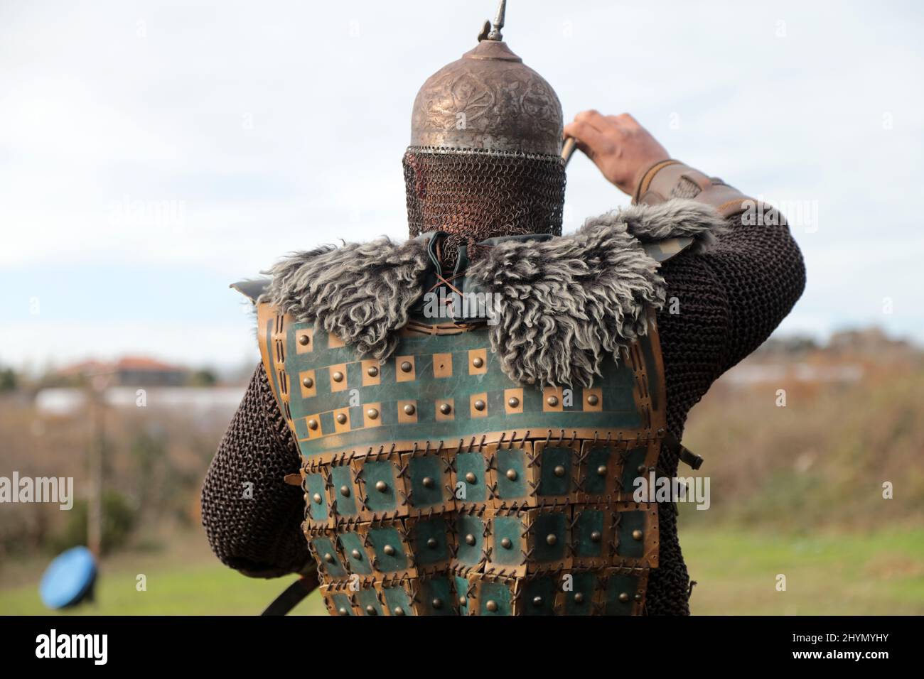 A Turkish soldier in traditional clothing. Back view of archer soldier ...