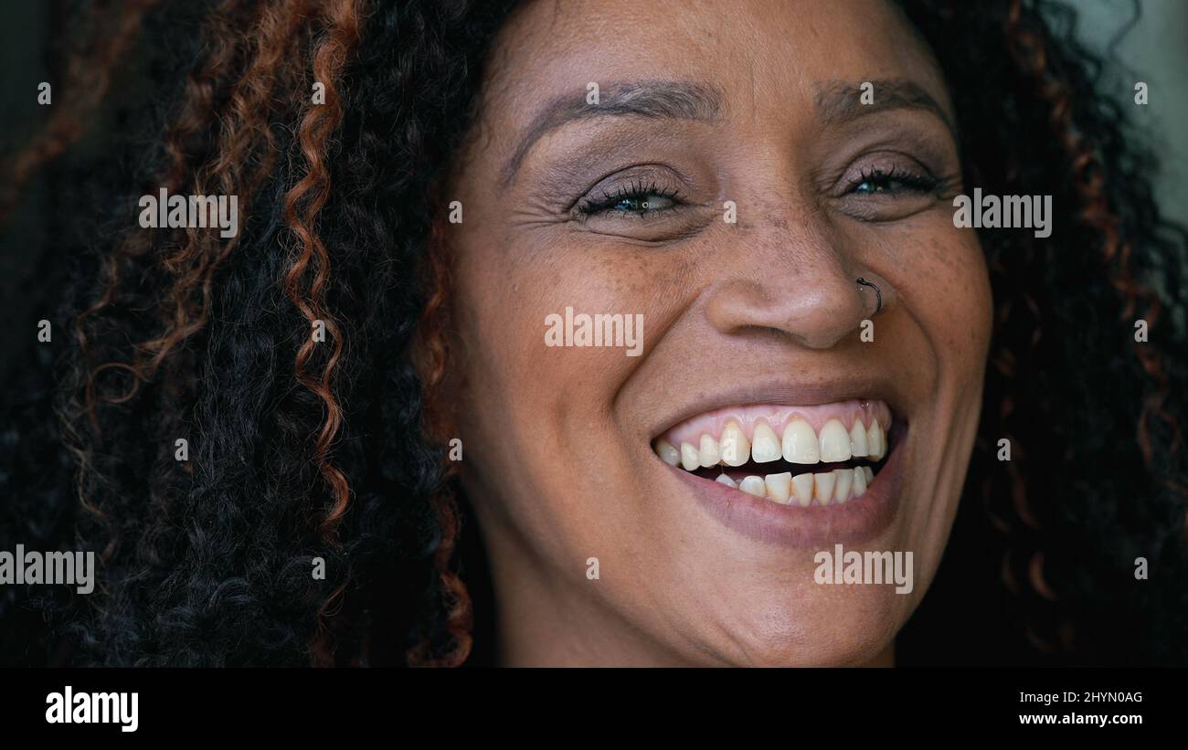 A smiling happy black woman portrait face a Brazilian hispanic person ...