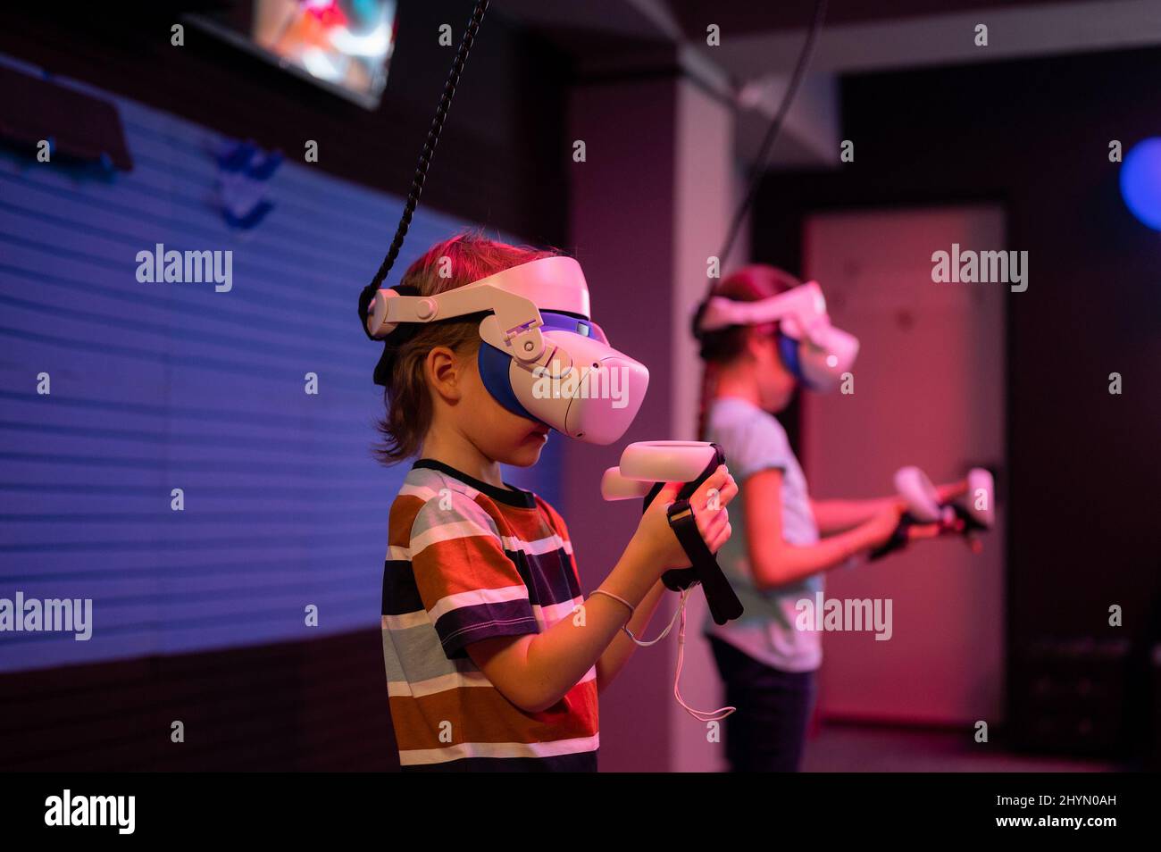 vr game and virtual reality. team kids friends gamers fun playing on ...