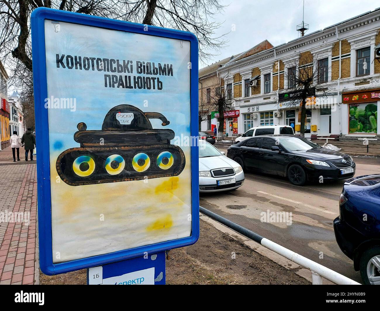 A poster featuring the phrase 'Konotop Witches at Work' is pictured in ...