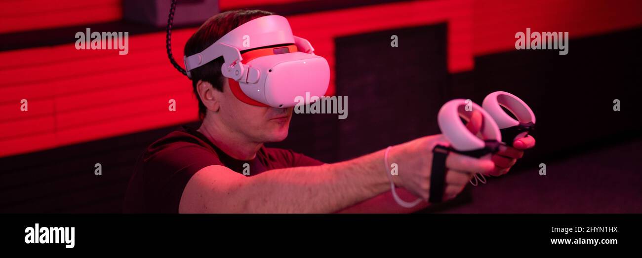 vr game and virtual reality. man gamer fun playing on futuristic ...