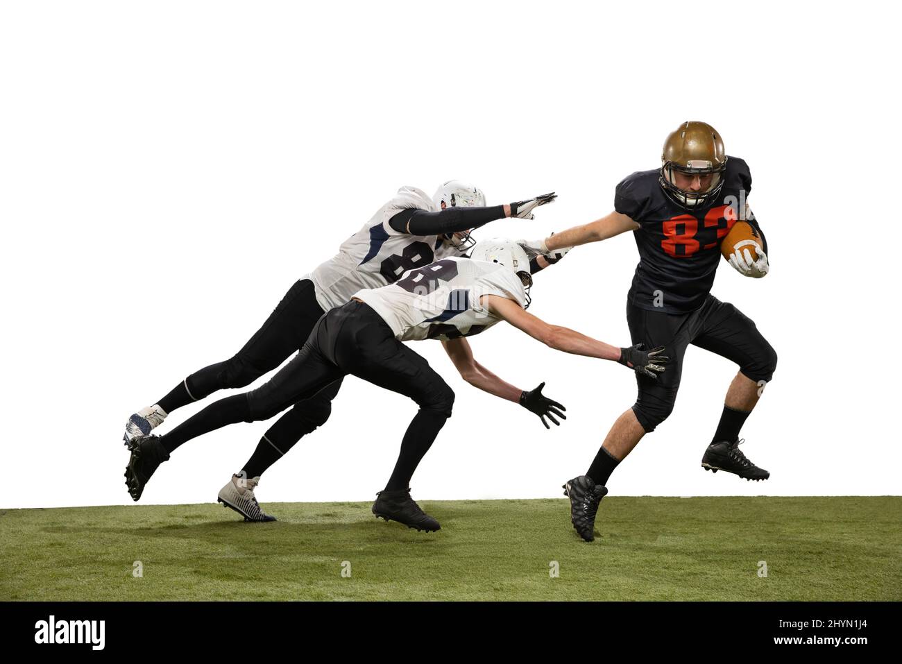 Three young sportive men, professional american football players in ...