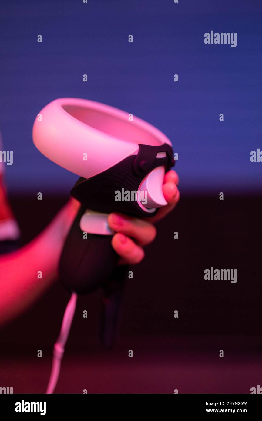 vr game and virtual reality. kid gamer hand holding play joystick and ...