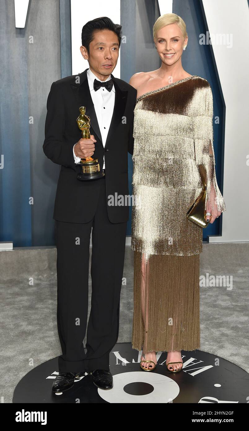 Kazu Hiro and Charlize Theron attending the Vanity Fair Oscar Party ...