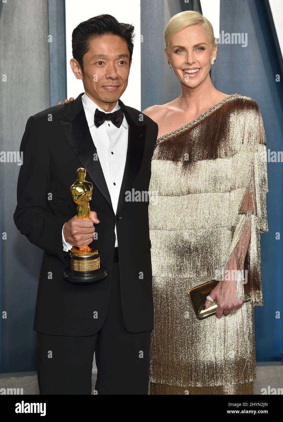 Kazu Hiro and Charlize Theron attending the Vanity Fair Oscar Party ...