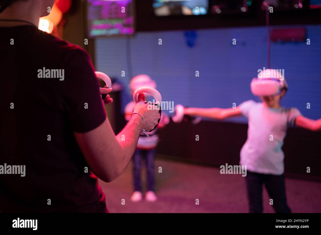 vr game and virtual reality. team family dad and kids gamers fun ...