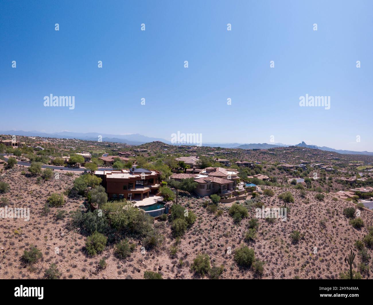 Mansions in desert area with green bushes in Fountain hills, Arisona ...
