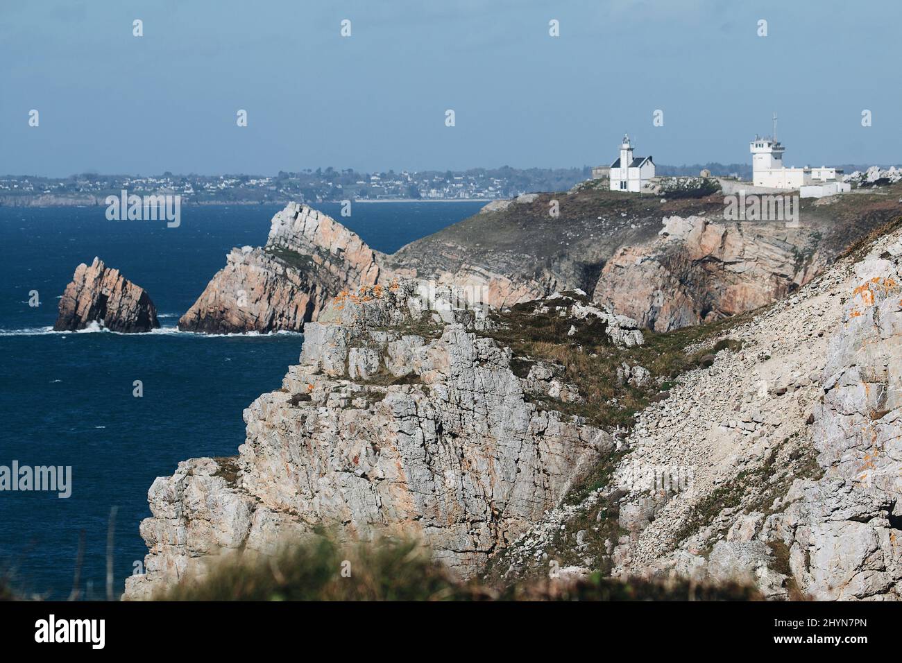 Shot of a lighthouse on the huge cliff Stock Photo - Alamy
