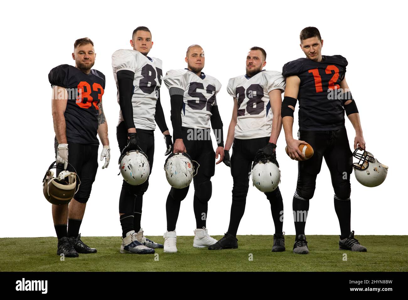 Group of young sportive men, professional american football players in ...
