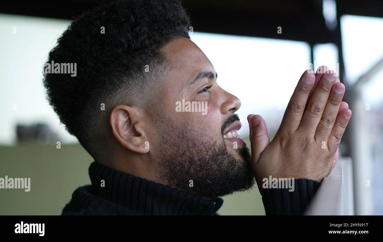 One man praying to God a latin hispanic person prays having HOPE Stock ...