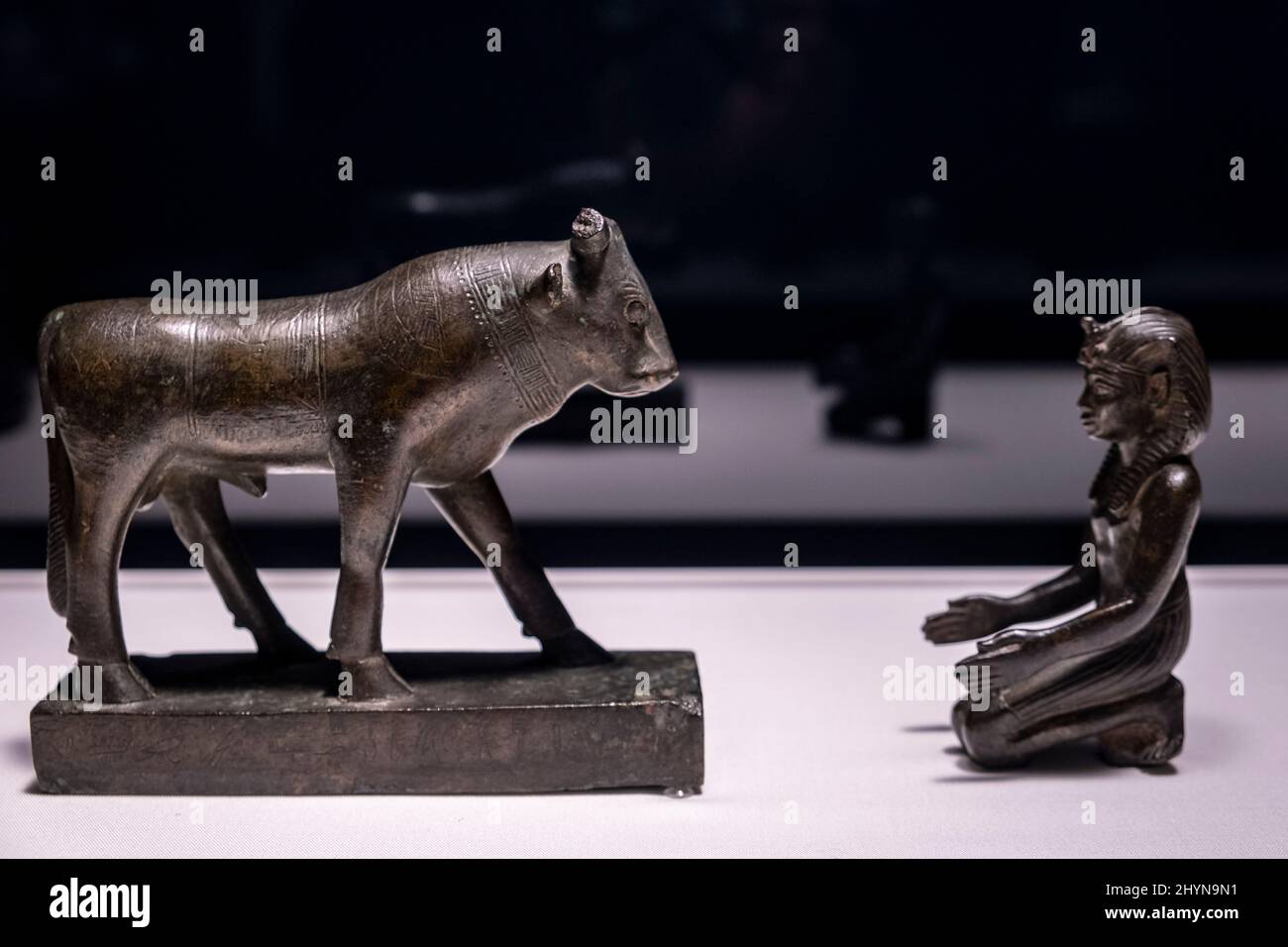 statue of a pharaoh kneeling before the Apis bull, bronze, late period ...