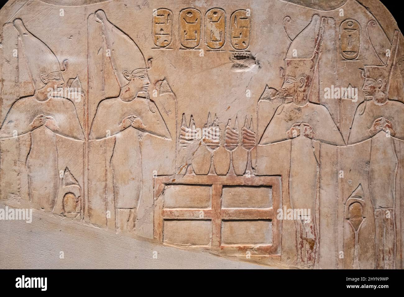 stela fragment with four standing sculptures, 18th dynasty, reign of ...