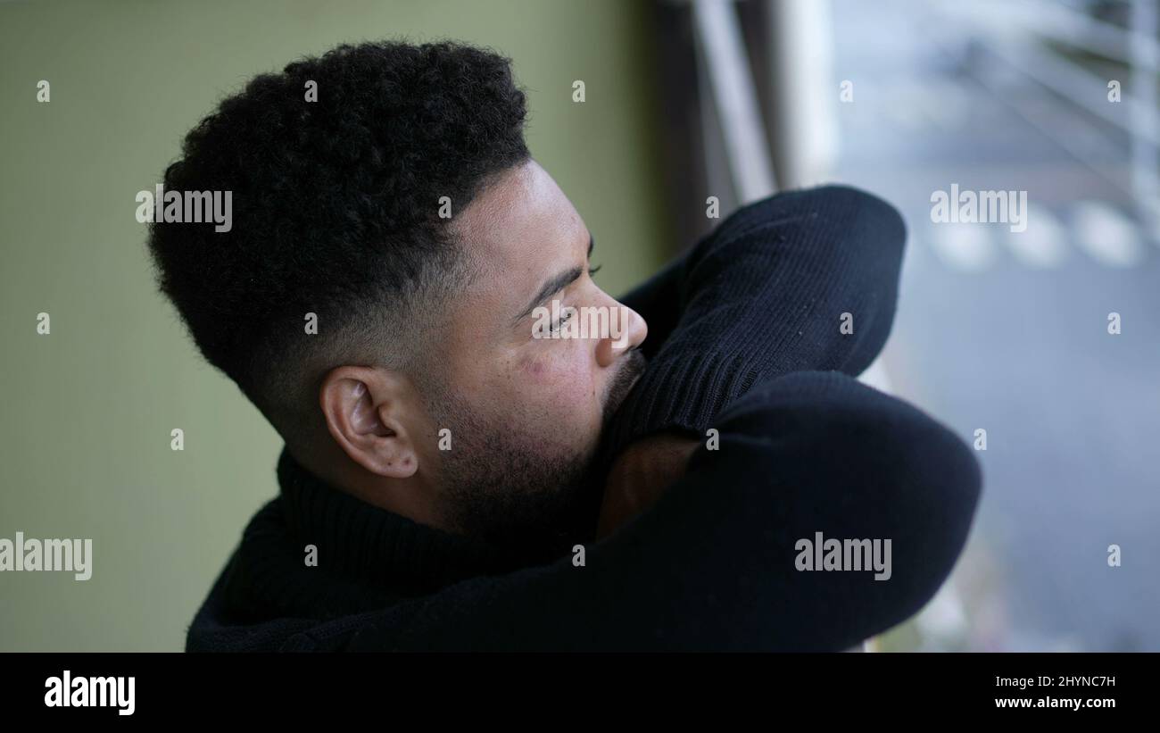 A pensive hispanic man thinking a contemplative person Stock Photo - Alamy